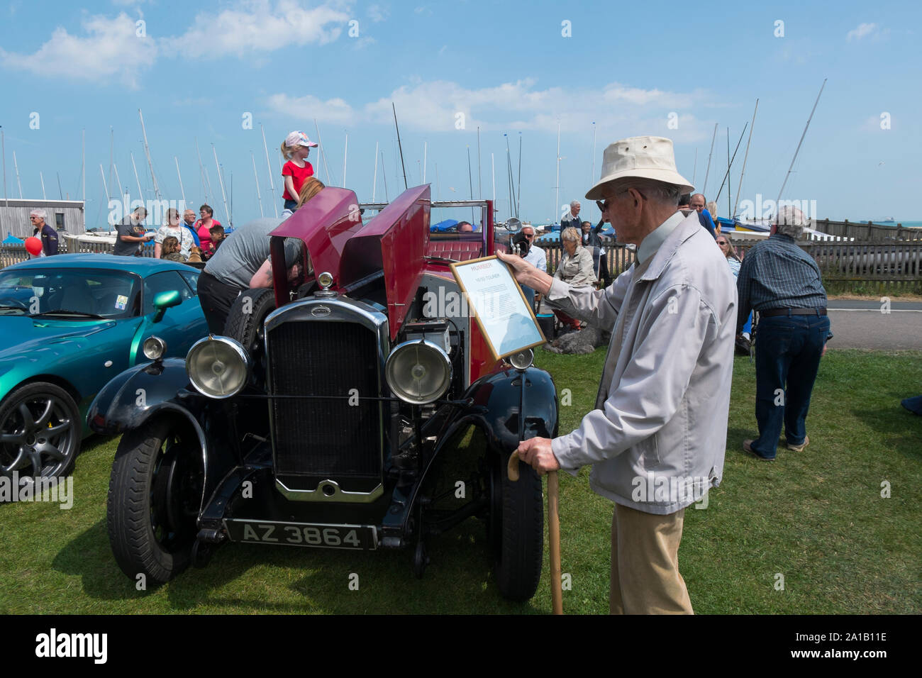An elderly man reading the details of a 1920s Humber 16/50 Tourer at ...