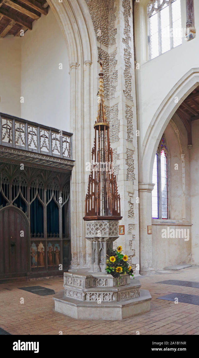 A view of the font and cover in the nave of the parish Church of St ...