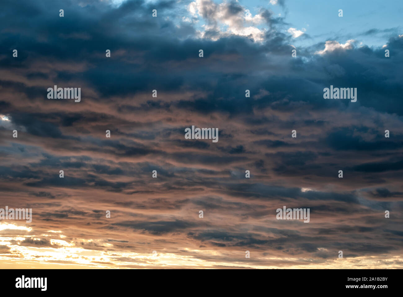 Red and gray thunderclouds against a blue sky and white cloud Stock ...