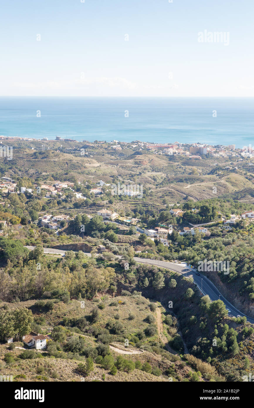 view point looking out aross the sea from the mountin side town of ...