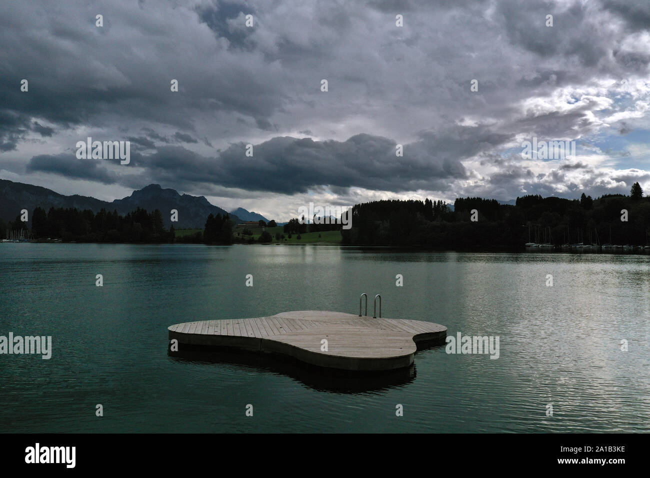 Germany. 25th Sep, 2019. Under dense clouds a deserted bathing platform ...