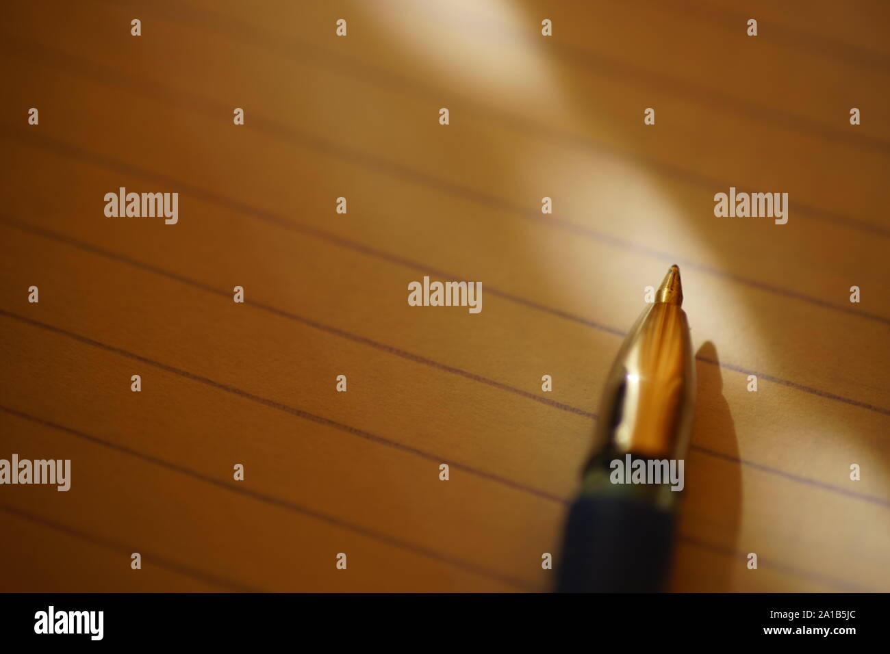 pen on notebook paper in a line, macro photo, place for text Stock ...
