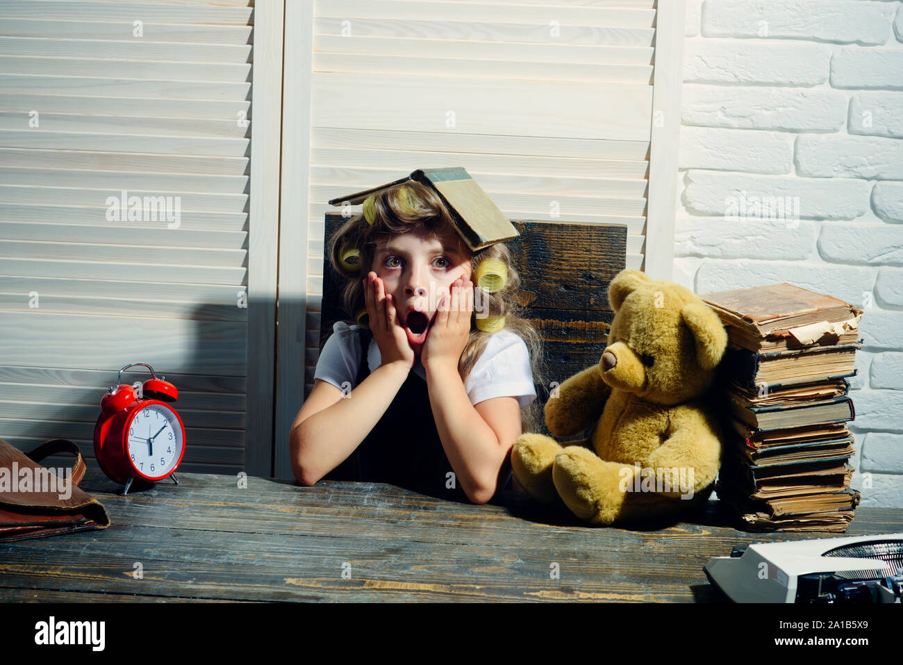 Education and childhood. Child with briefcase and alarm clock. Kid ...