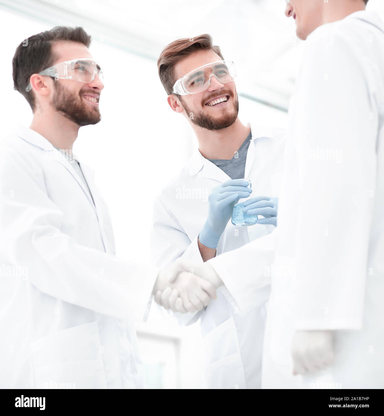 blurred image of a handshake between scientists Stock Photo - Alamy