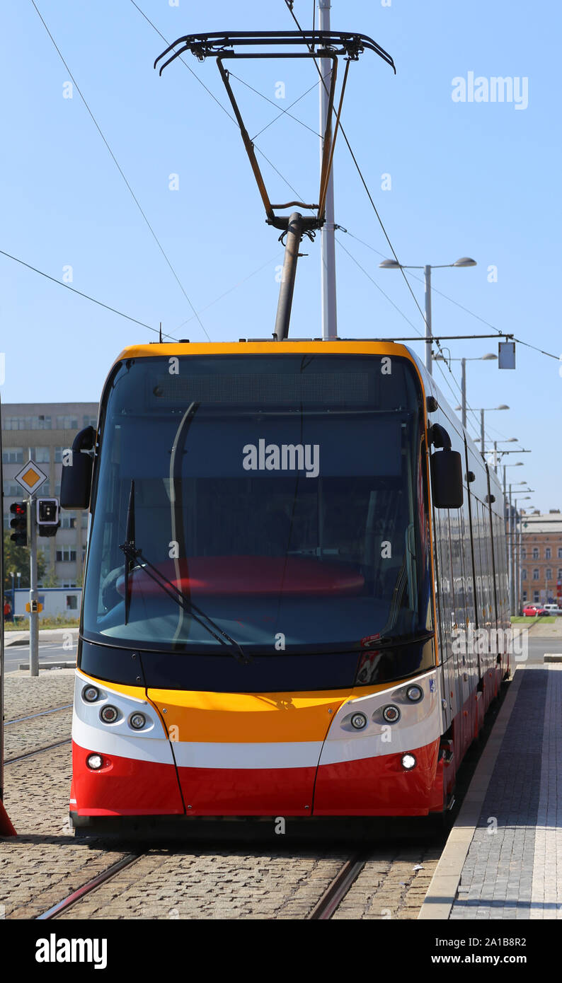 electrified tram on the railroad in the city Stock Photo - Alamy
