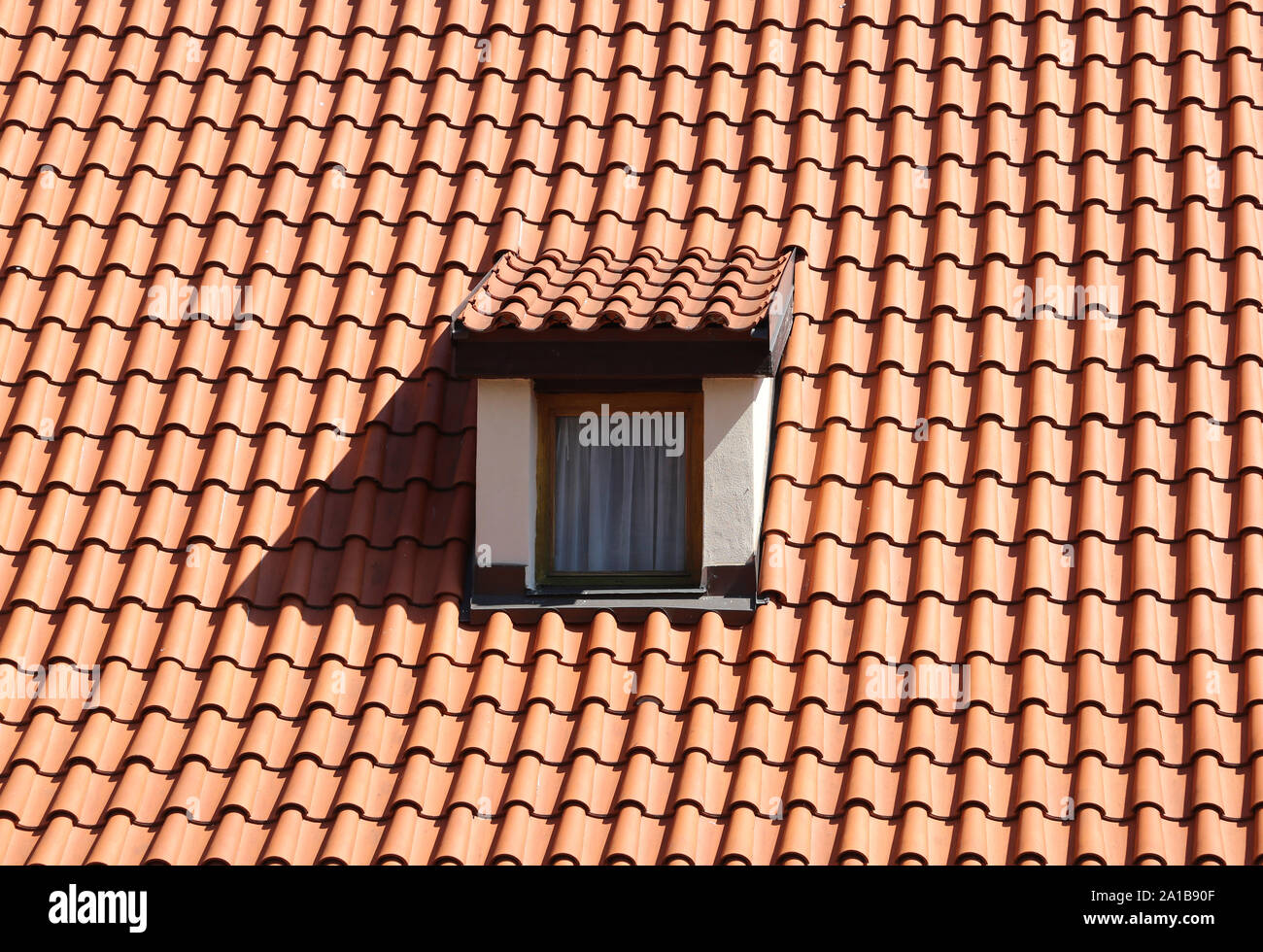 roof with tiles and a window called dormer in an european city Stock ...