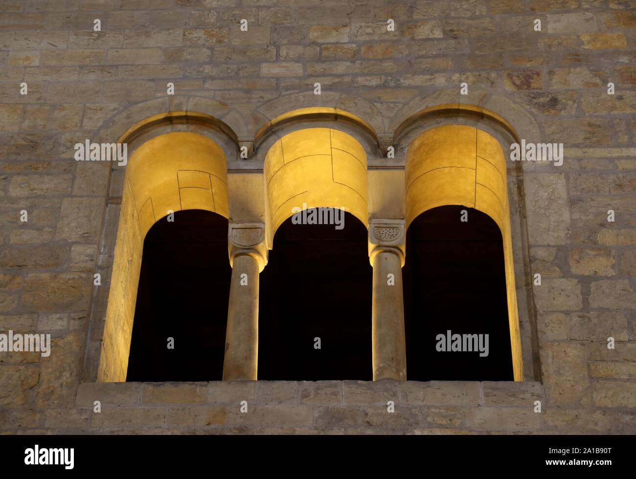 three old windows on the medieval building Stock Photo - Alamy