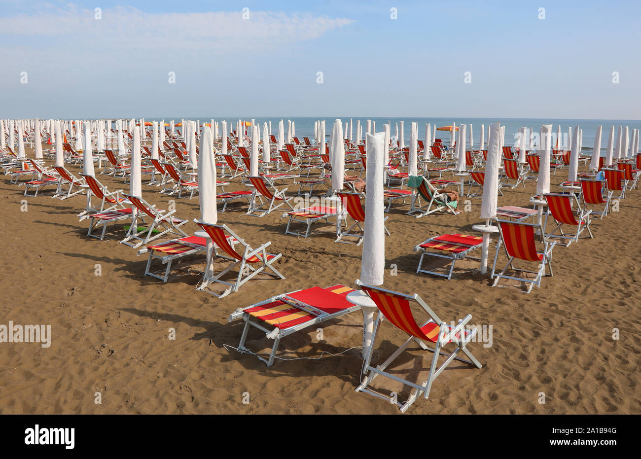 beach on late summer without people and many closed parasoil Stock ...