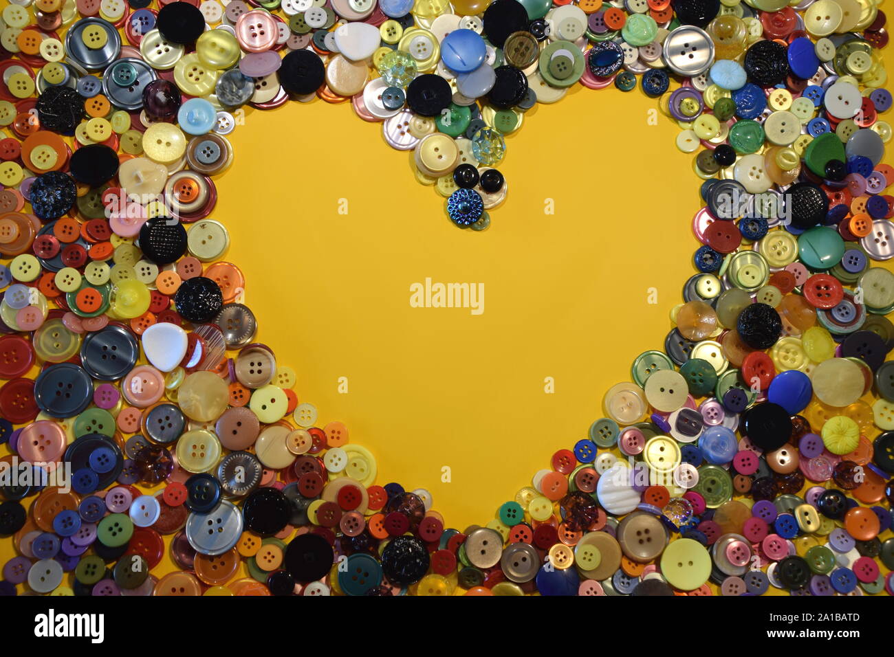 coloured mix of buttons of different size and shape Stock Photo - Alamy