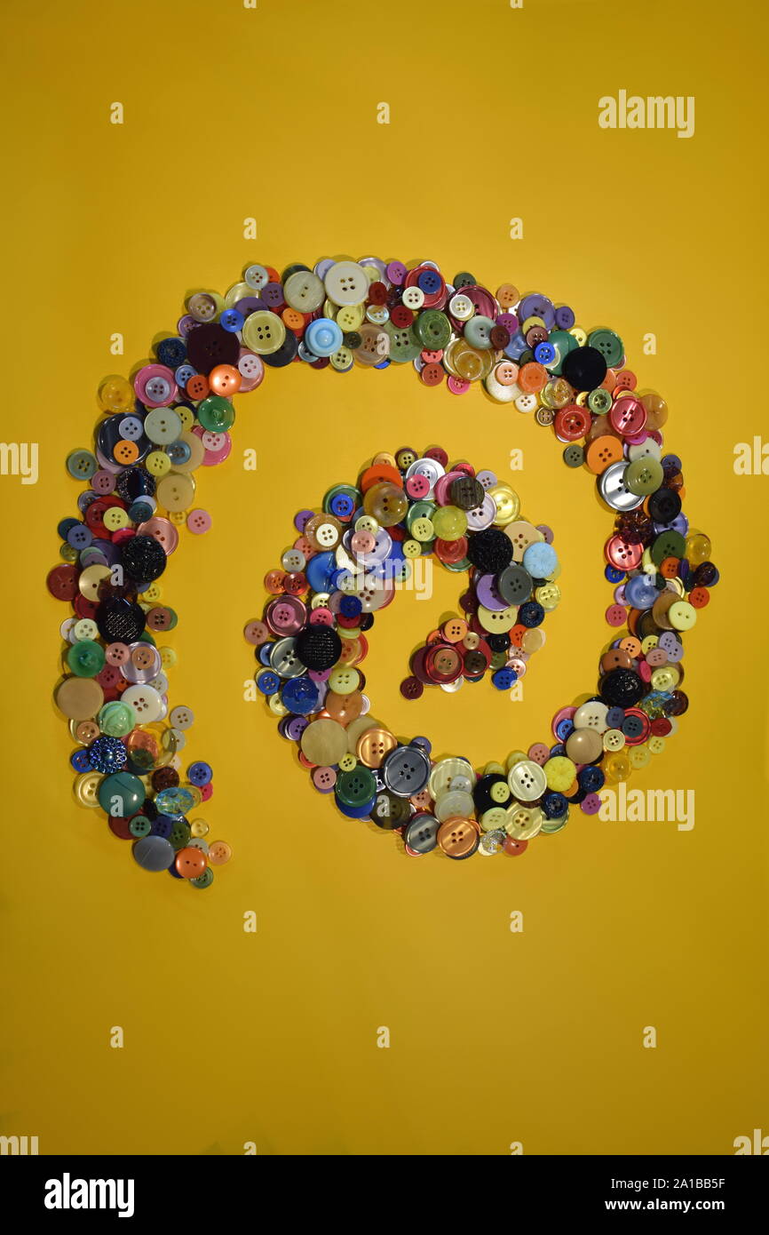 coloured mix of buttons of different size and shape Stock Photo - Alamy