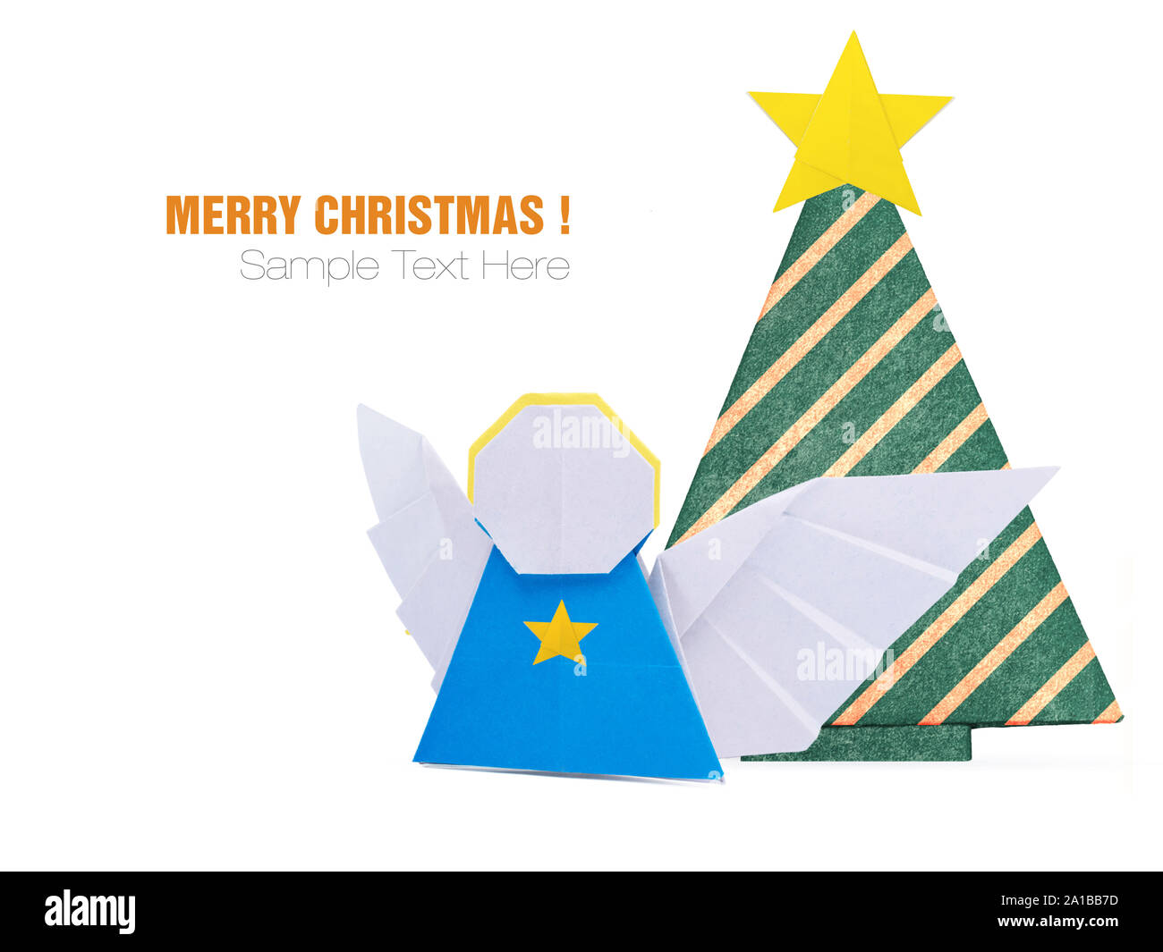 Christmas origami angel decorations in paper on a white background ...