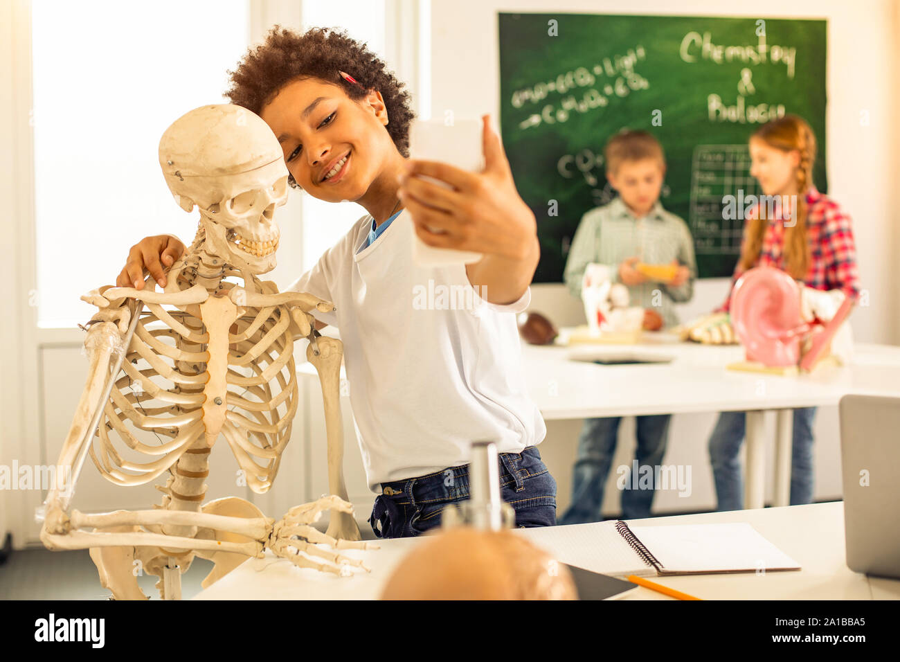 Cheerful kids spending break in their classroom Stock Photo - Alamy