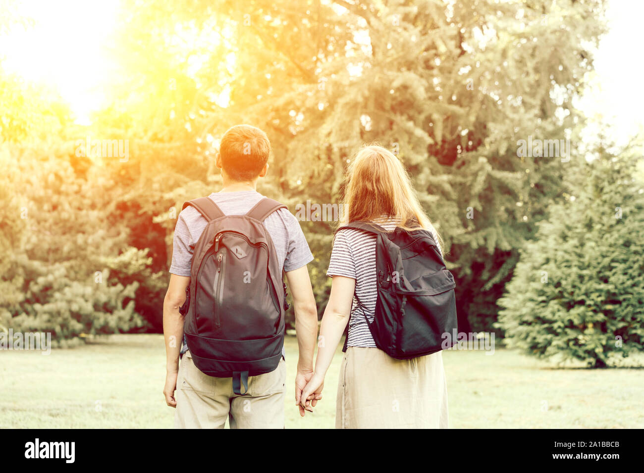 Boy girl back holding hand hi-res stock photography and images - Alamy
