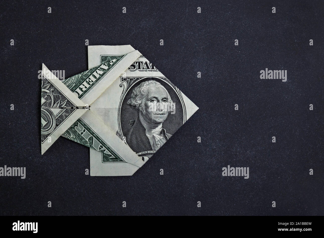 Origami dollar fish Stock Photo - Alamy