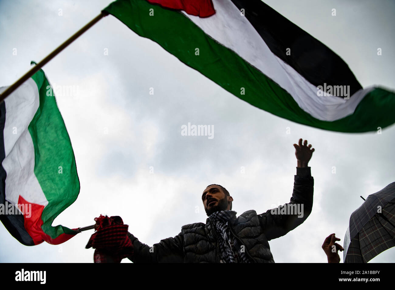 Germany. 25th Sep, 2019. A man swings a Palestinian flag during a "pro ...
