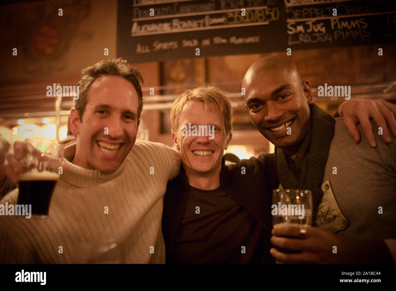 Friends drinking together at a pub Stock Photo - Alamy