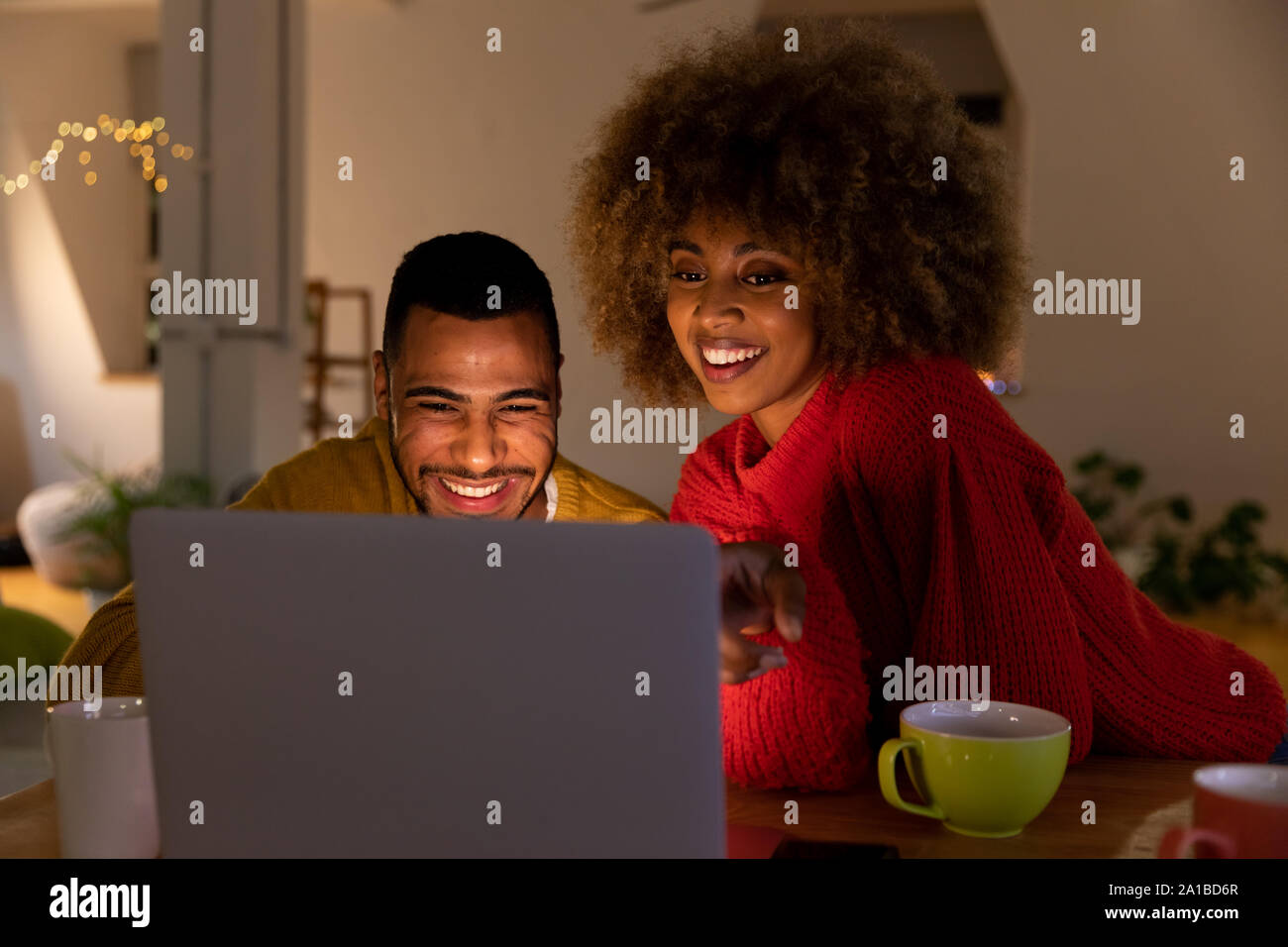 Millennial adult friends socialising together at home Stock Photo - Alamy