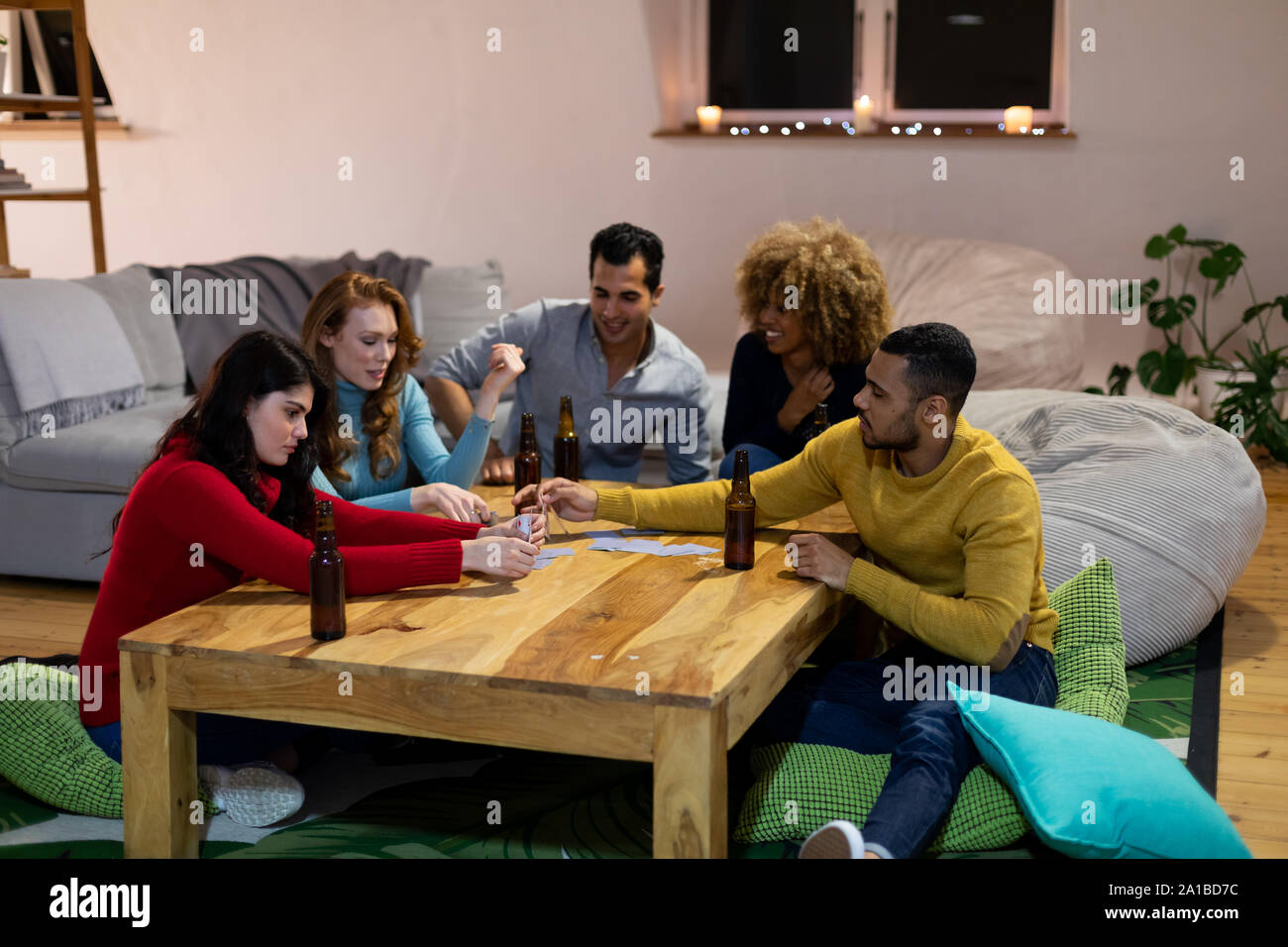 Millennial adult friends socialising together at home Stock Photo - Alamy