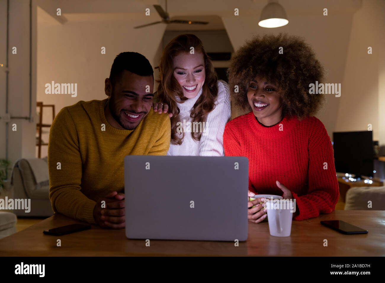 Millennial adult friends socialising together at home Stock Photo - Alamy