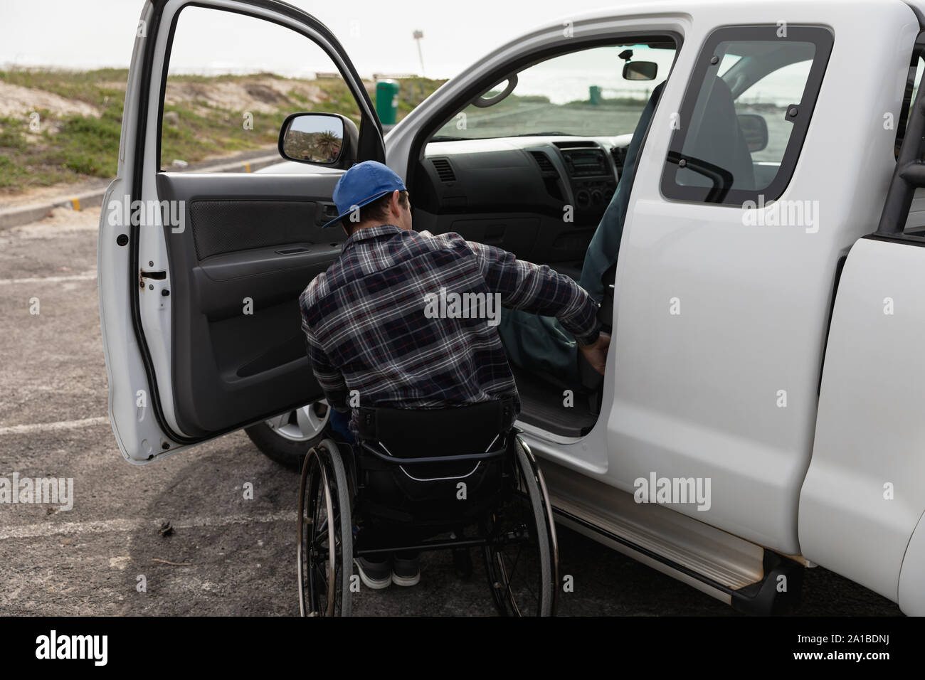 Disabled man in a wheelchair enjoying a day out Stock Photo - Alamy