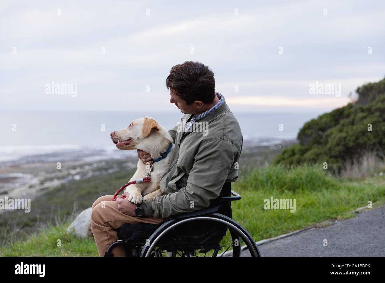 Disabled man in a wheelchair enjoying a day out Stock Photo - Alamy