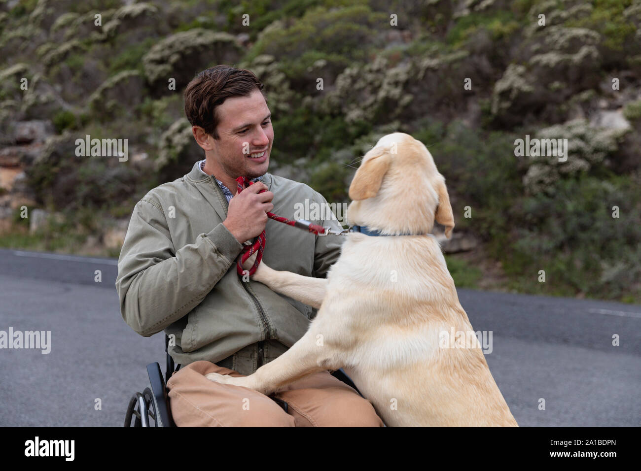 Disabled man in a wheelchair enjoying a day out Stock Photo - Alamy