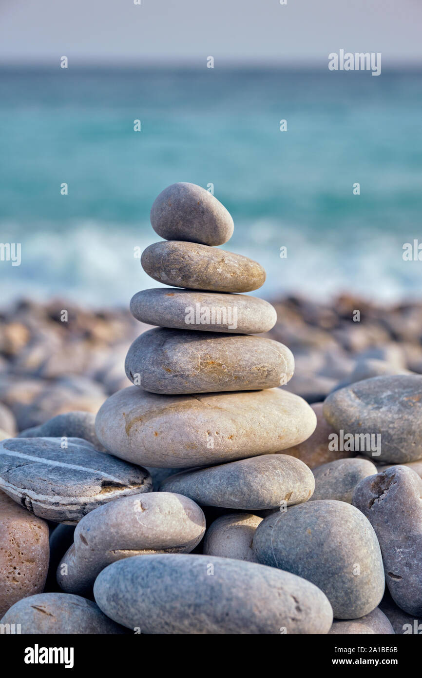 Zen balanced stones stack on beach Stock Photo - Alamy