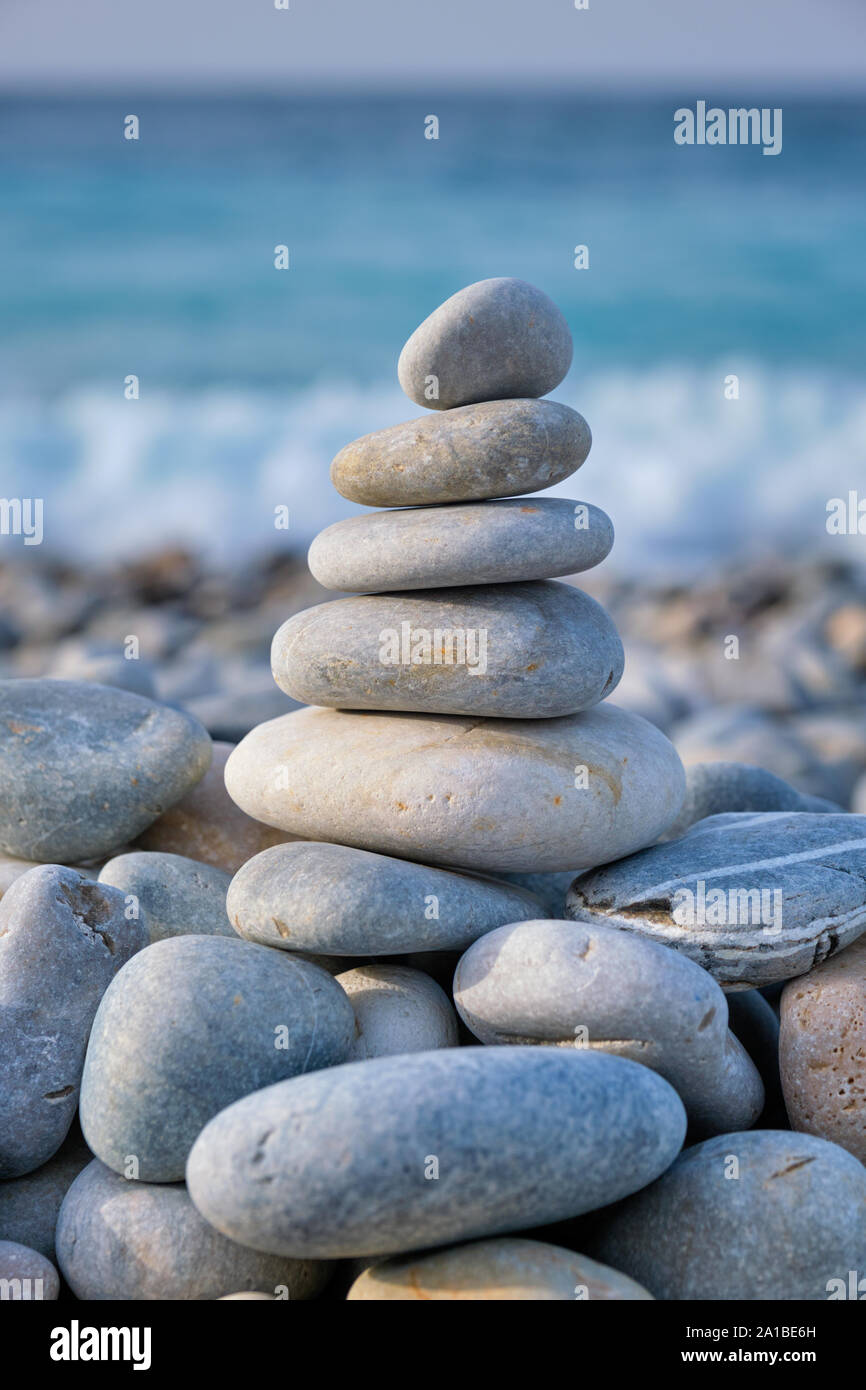 Zen balanced stones stack on beach Stock Photo - Alamy