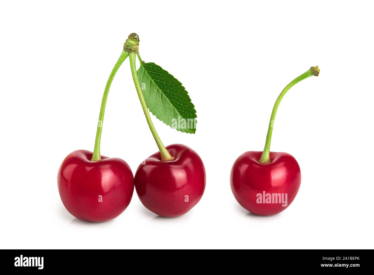 Three cherries with leaf closeup isolated on white background Stock ...