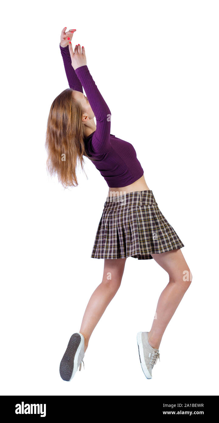 Side view of a woman dancing ballet. The girl is balancing. backside ...