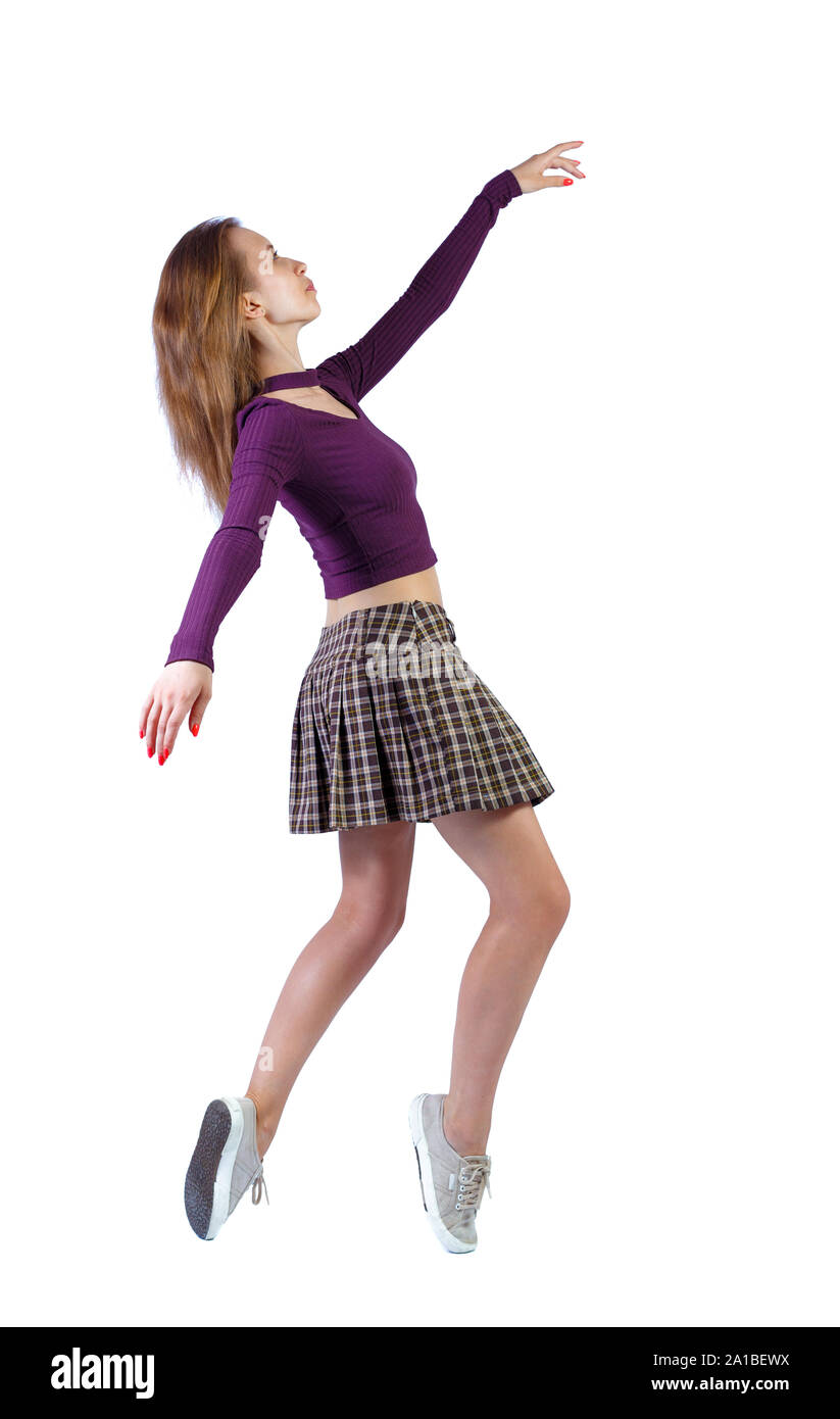 Side view of a woman dancing ballet. The girl is balancing. backside ...