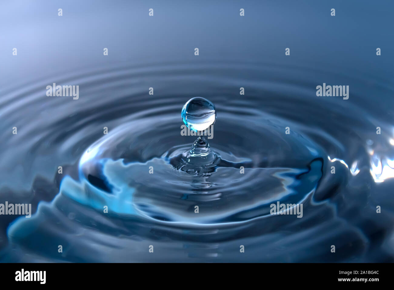 Water splash or drop. Water splash close-up. Blue water drop. Falling ...