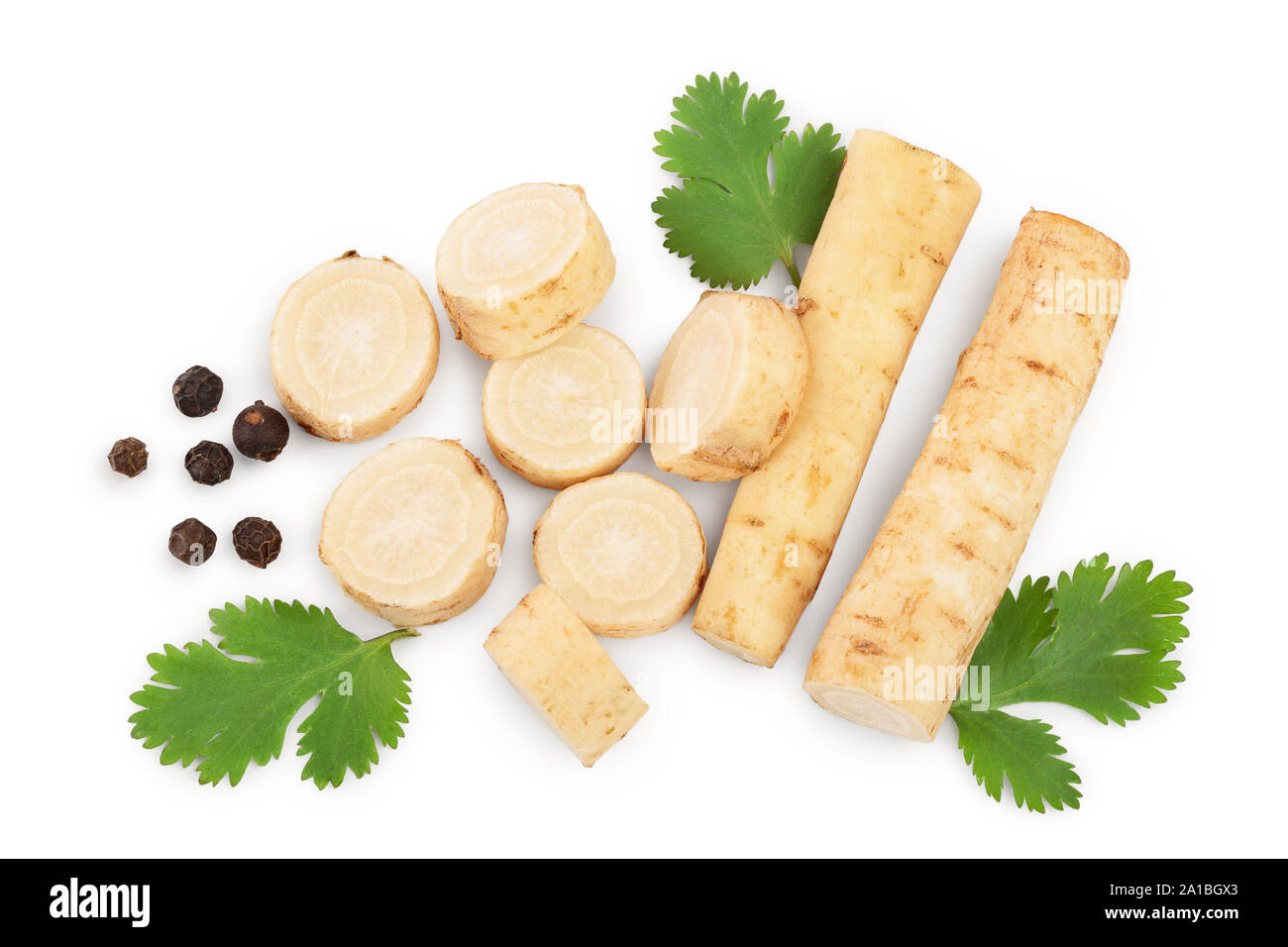 Parsnip root and slices with parsley peppercorns isolated on white ...
