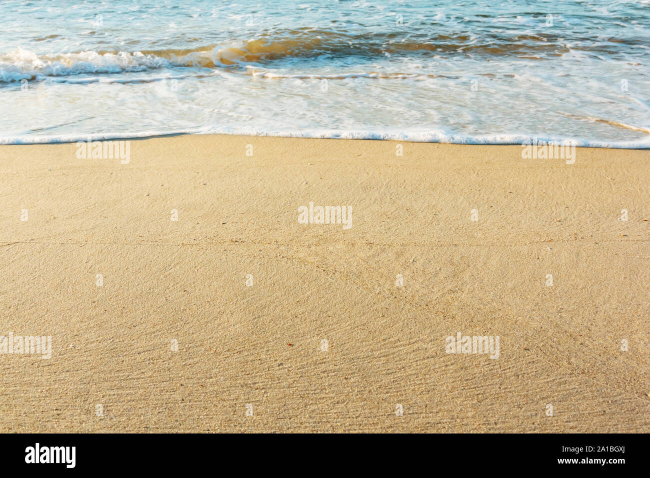 Sand beach with wave Stock Photo - Alamy