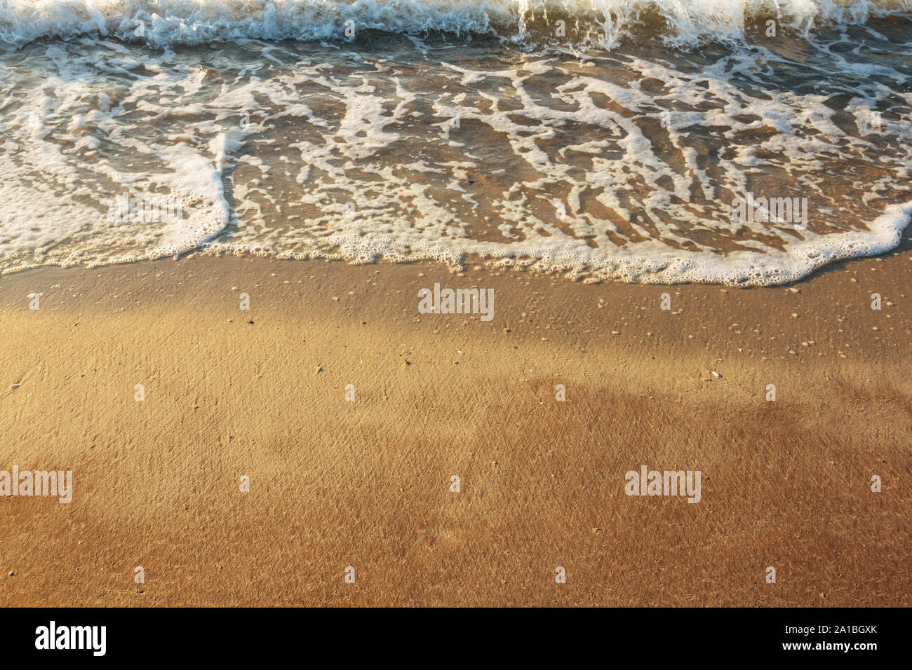 Sand beach with wave Stock Photo - Alamy