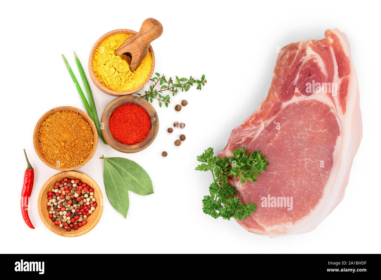 sliced raw pork meat with parsley isolated on white background. Top ...