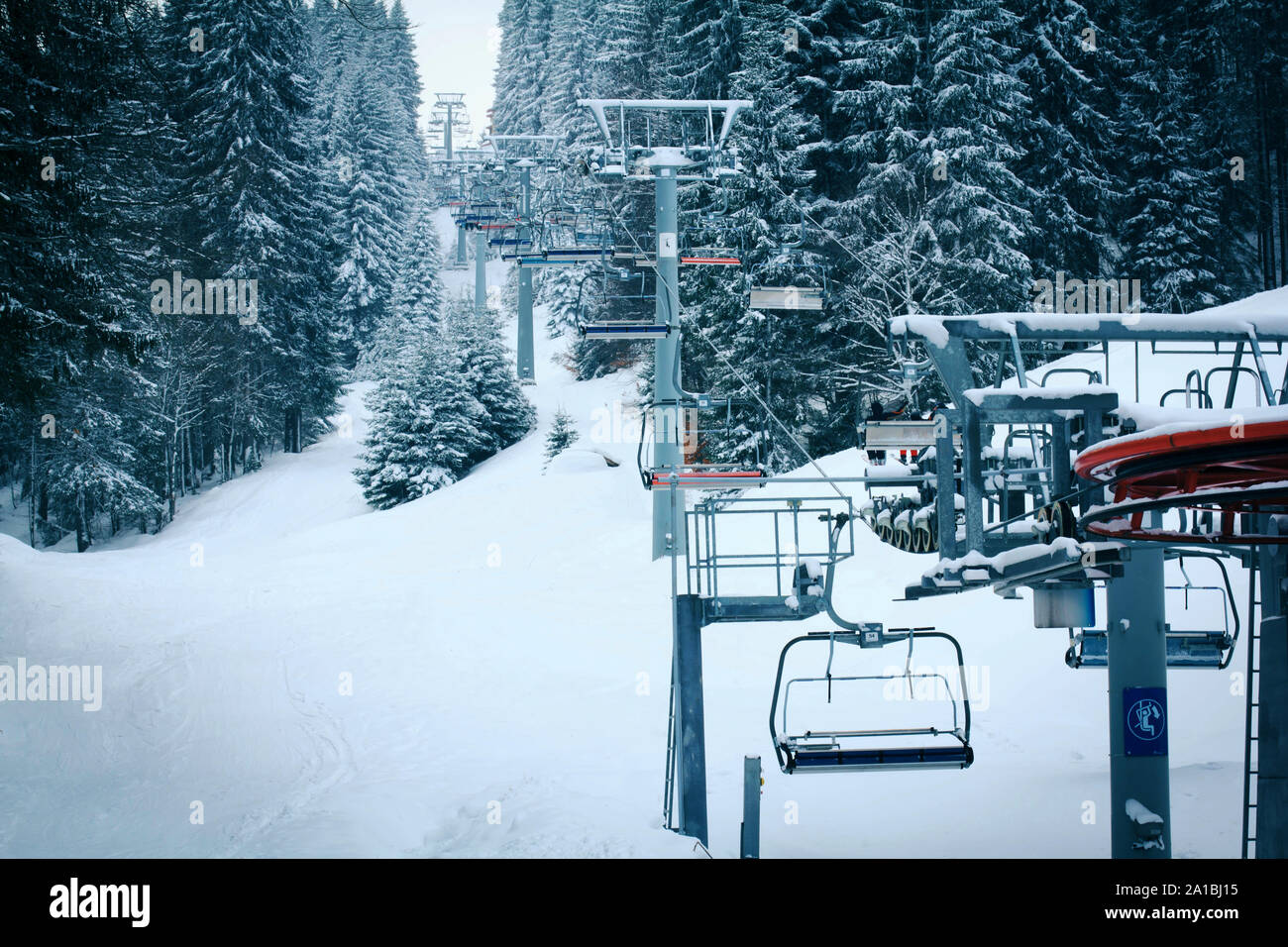 Ski lift in the forest Stock Photo - Alamy