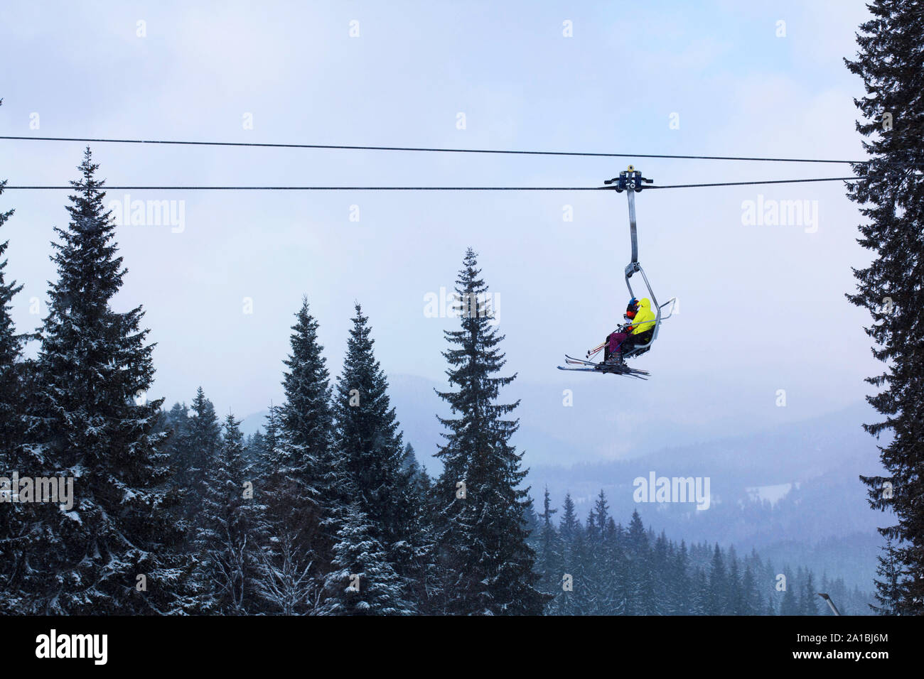 Ski lift in the forest Stock Photo - Alamy