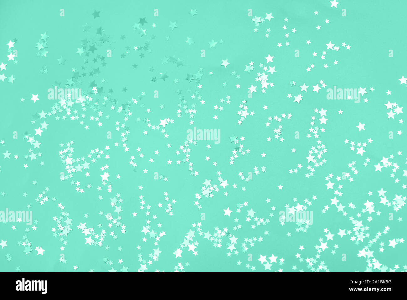 White and green stars scattering on mint background. Festive concept ...
