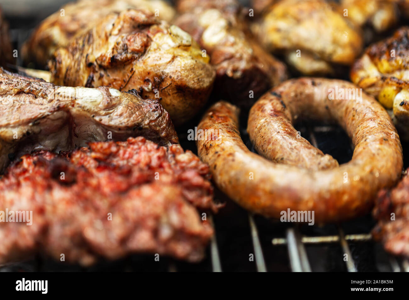 Barbeque grill mixed meat cooking on open air Stock Photo - Alamy