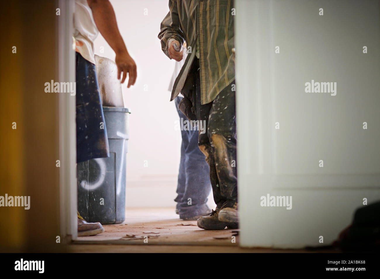 Builders standing inside a room Stock Photo - Alamy