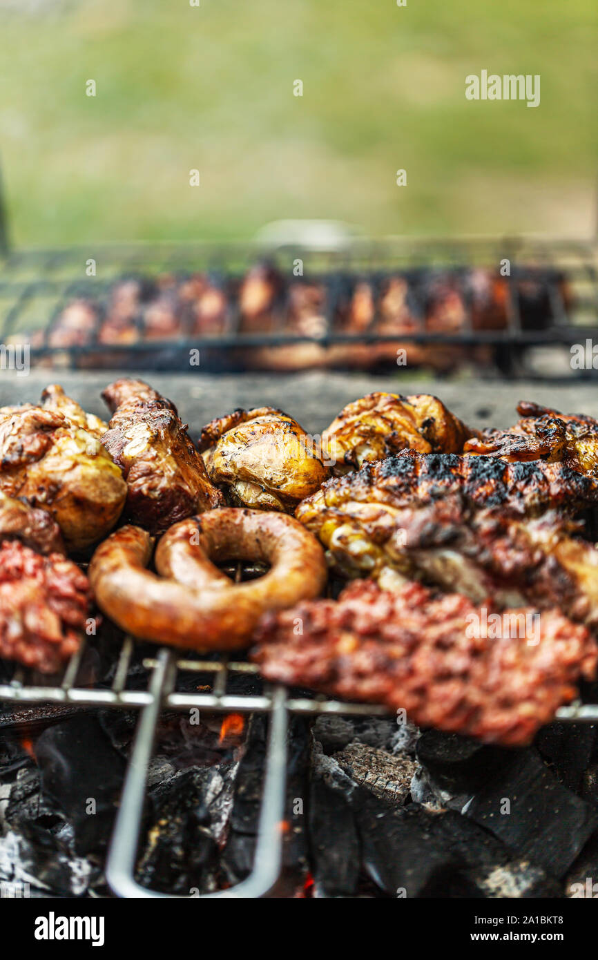 Barbeque grill mixed meat cooking on open air Stock Photo - Alamy