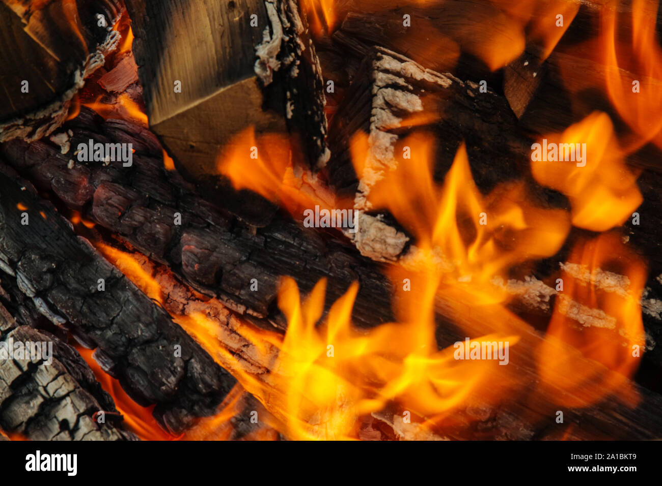 Firewood bonfire background Stock Photo - Alamy