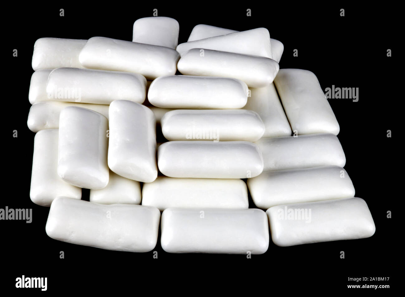 Stack of chewing gum pieces isolated on a black background Stock Photo ...