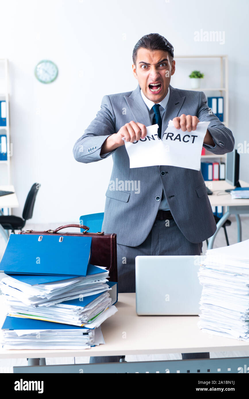 The businessman with heavy paperwork workload Stock Photo - Alamy
