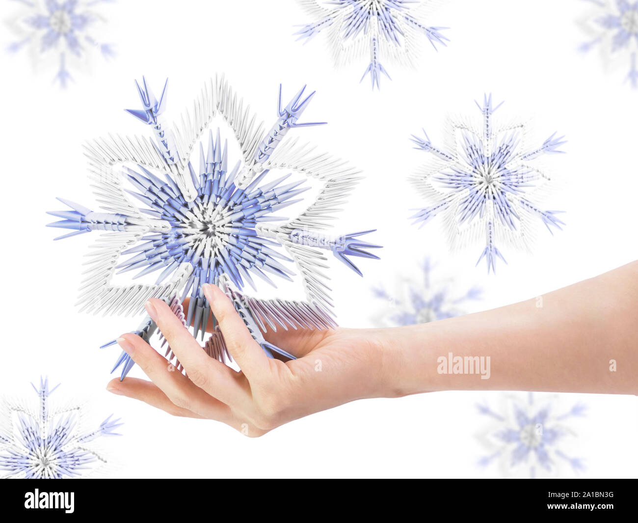 Snowflake in a hand Stock Photo - Alamy