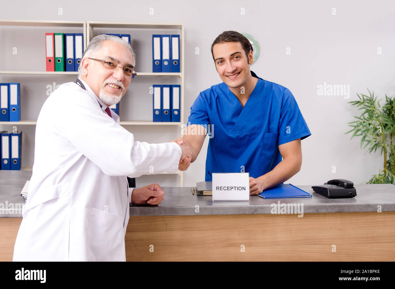 Doctors talking at the reception in hospital Stock Photo - Alamy