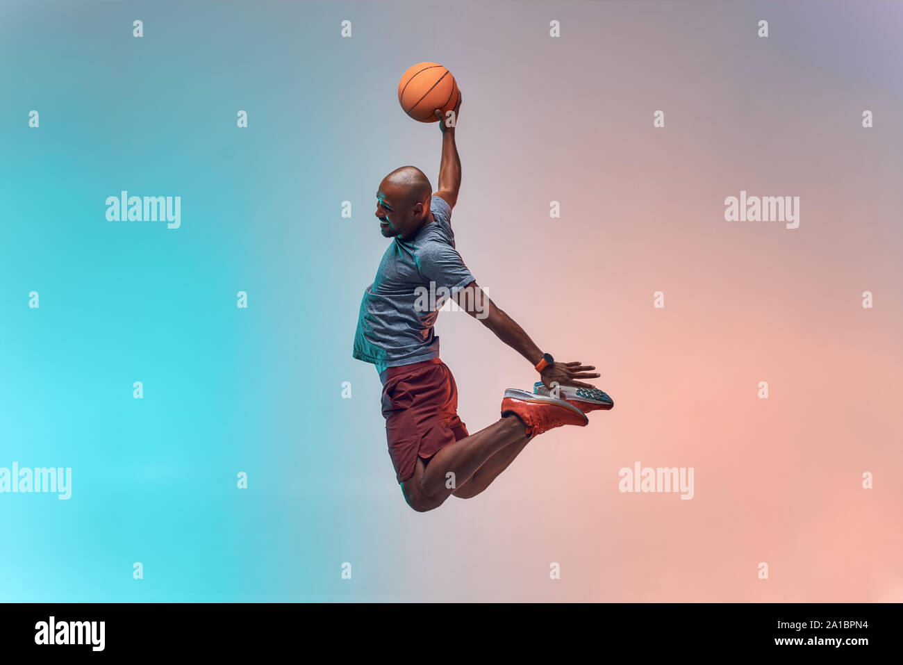 Slam Dunk Full Length Of Young African Backetball Player Jumping