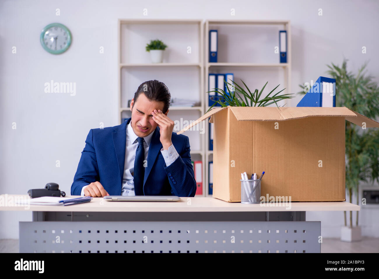The young employee being made redundant Stock Photo - Alamy