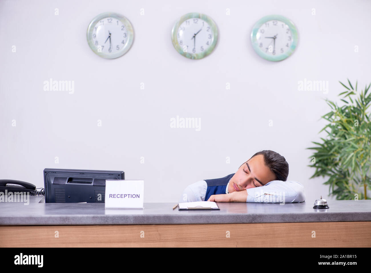 Tired hotel staff hi-res stock photography and images - Alamy